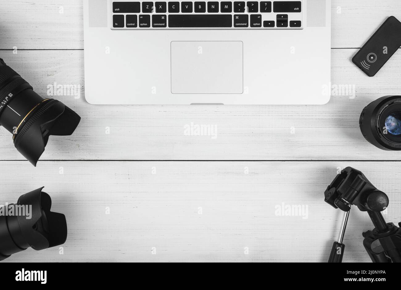 Overhead view laptop with camera accessories white desk . High quality ...