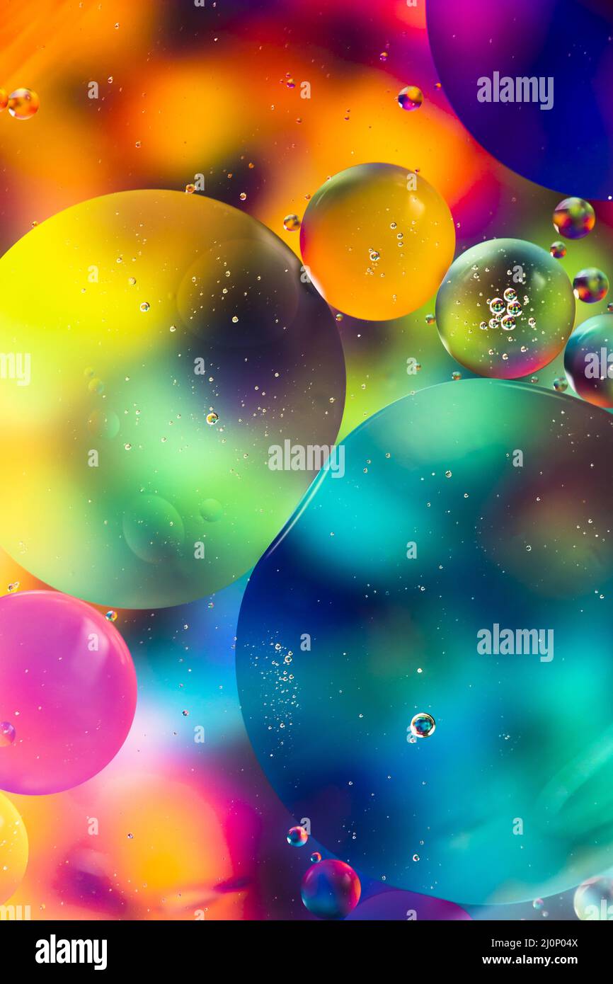 Rainbow oil drops water surface abstract background . High quality and ...