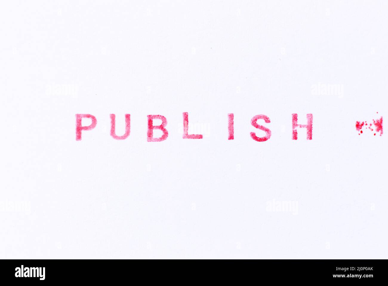 Red color ink rubber stamp in word publish on white paper background ...