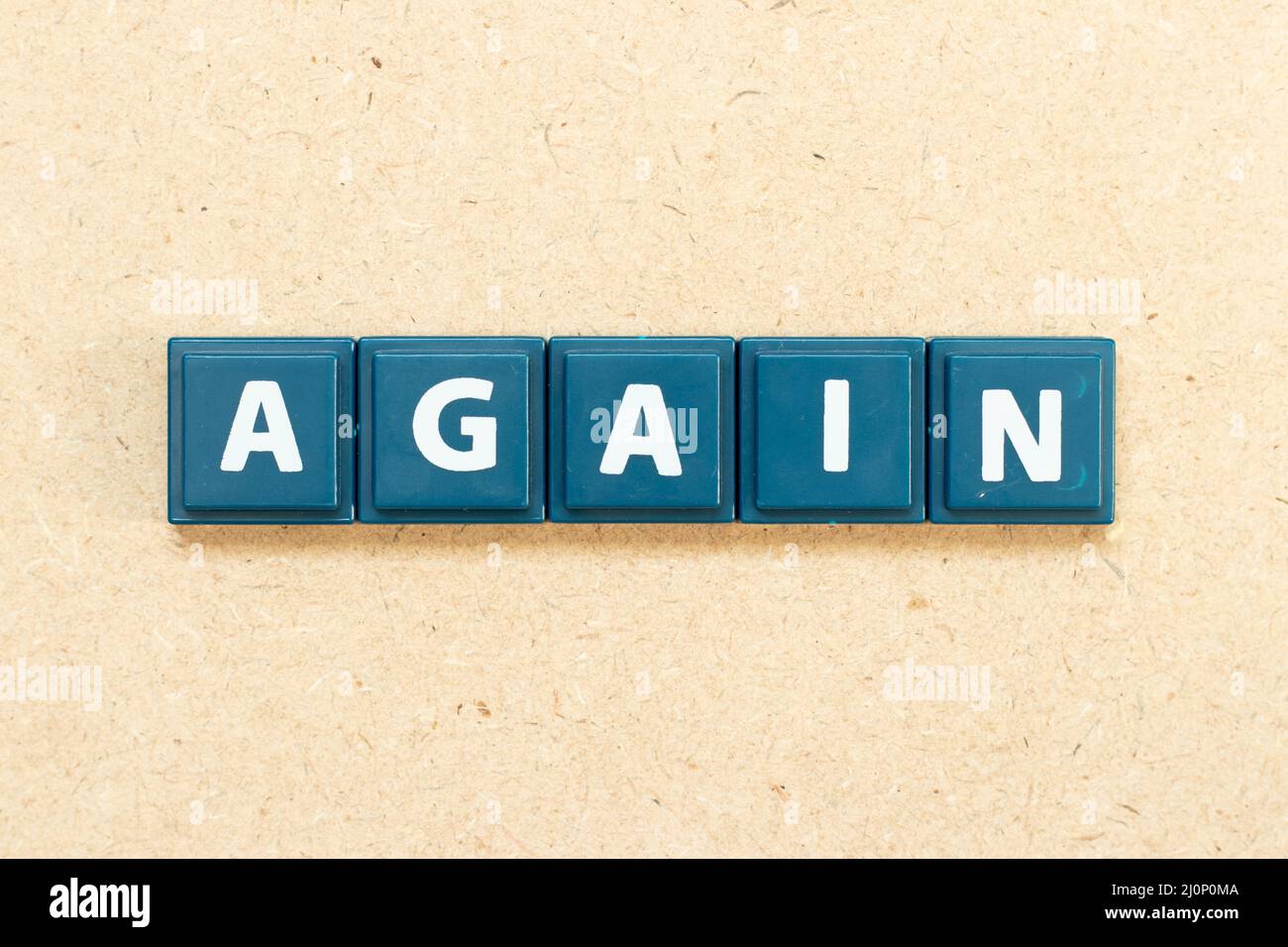 Tile alphabet letter in word again on wood background Stock Photo - Alamy