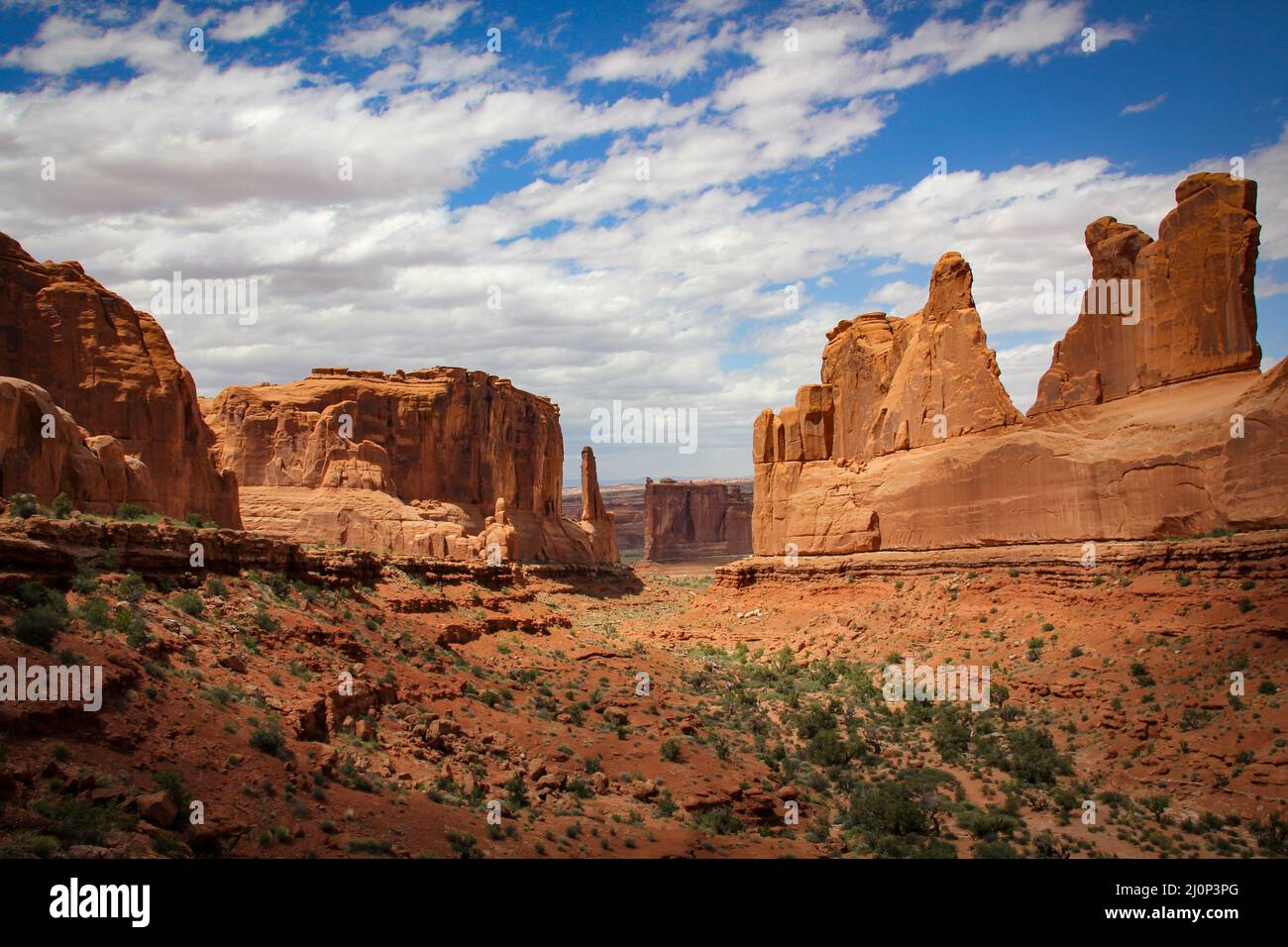Majestic cliffs and rocky textures of Moab under a blue, but cloudy sky ...