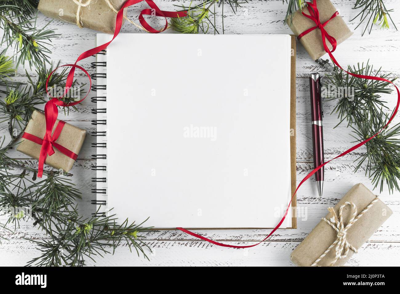 Notepad with fir tree branches table . High quality and resolution ...