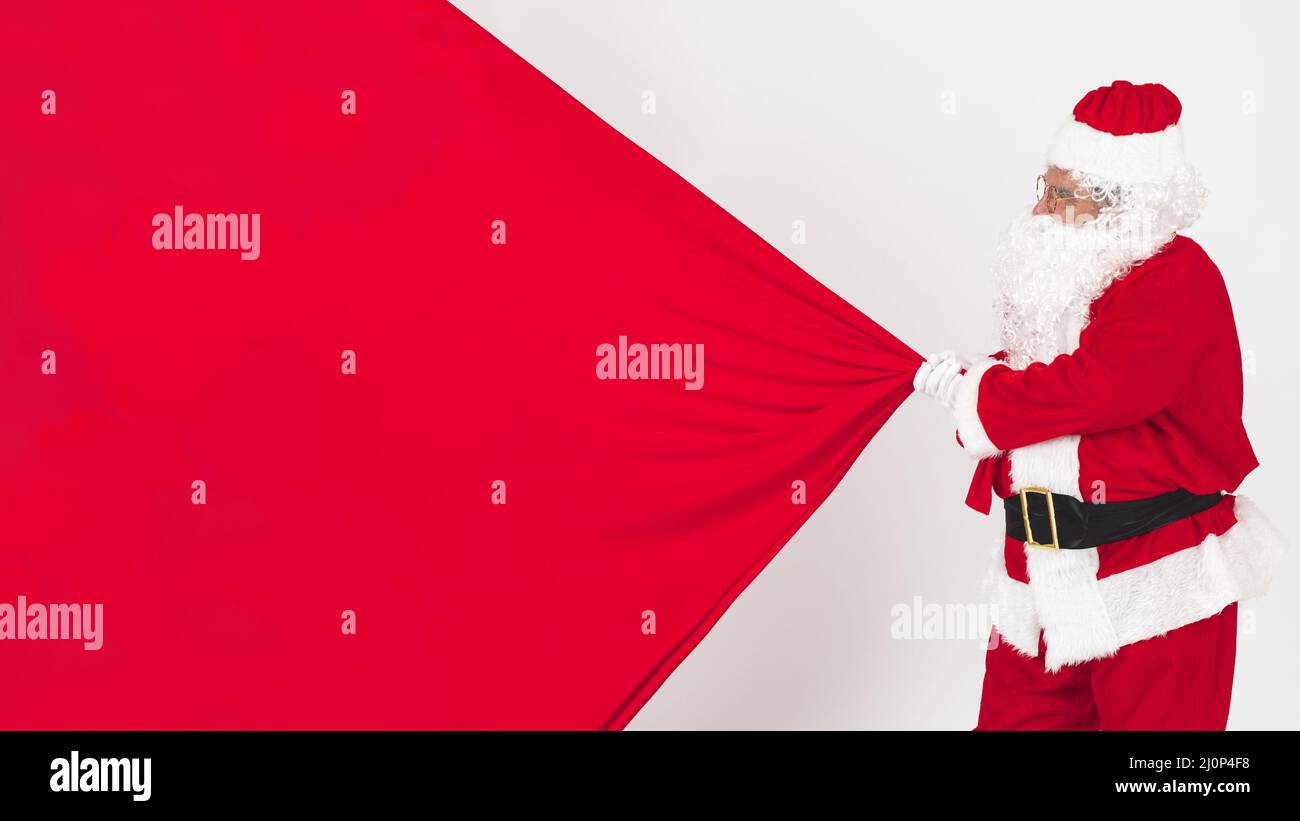 Santa claus pulling christmas bag. High quality and resolution ...