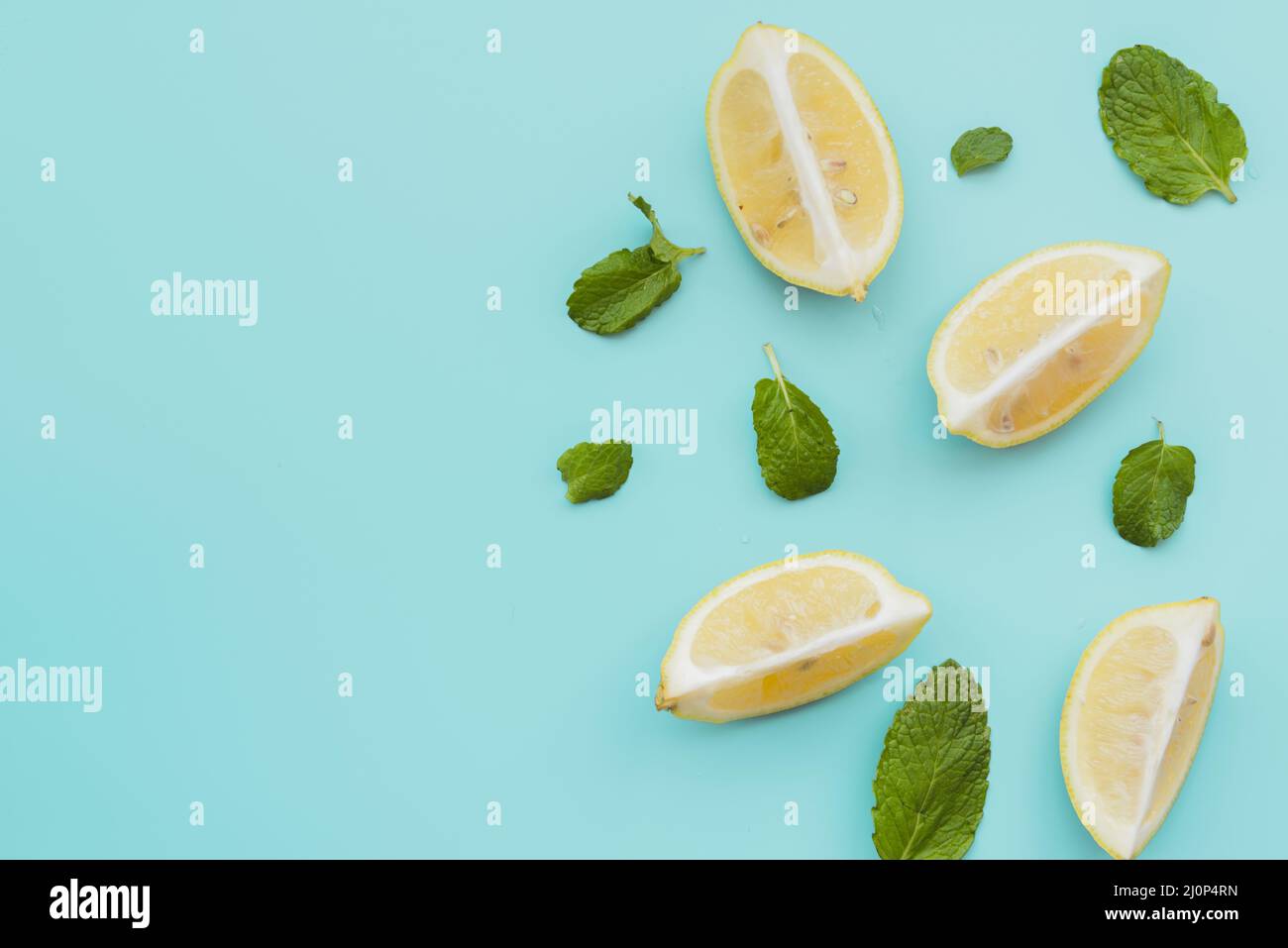 Lemon wedges mint leaves background . High quality and resolution ...