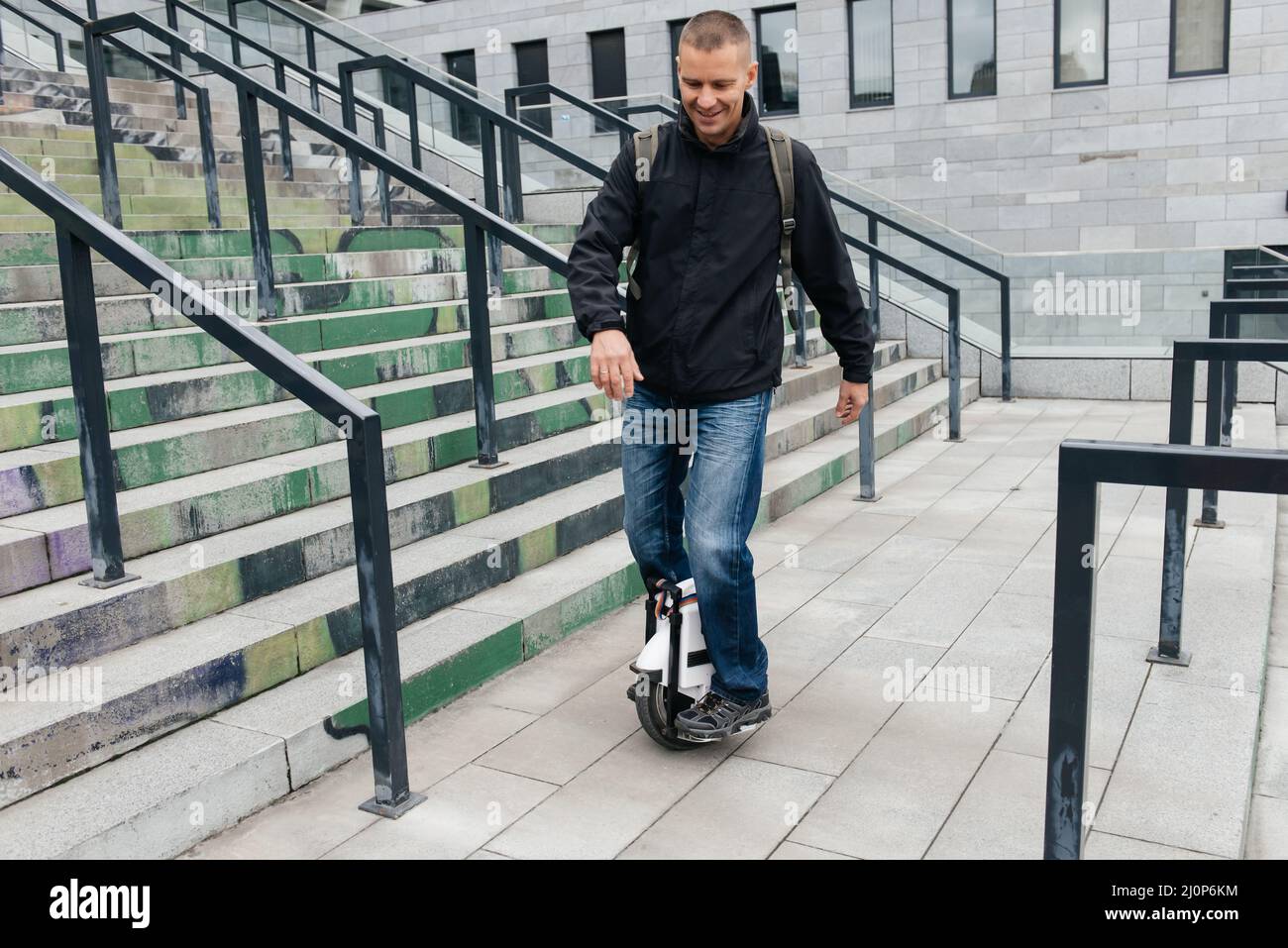 Man riding unicycle hi-res stock photography and images - Alamy