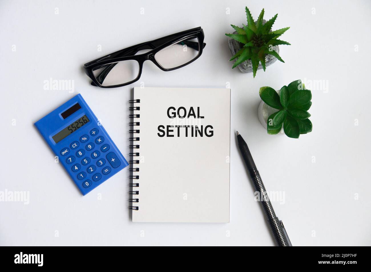 Goal setting text on notepad with office concept background. Business ...