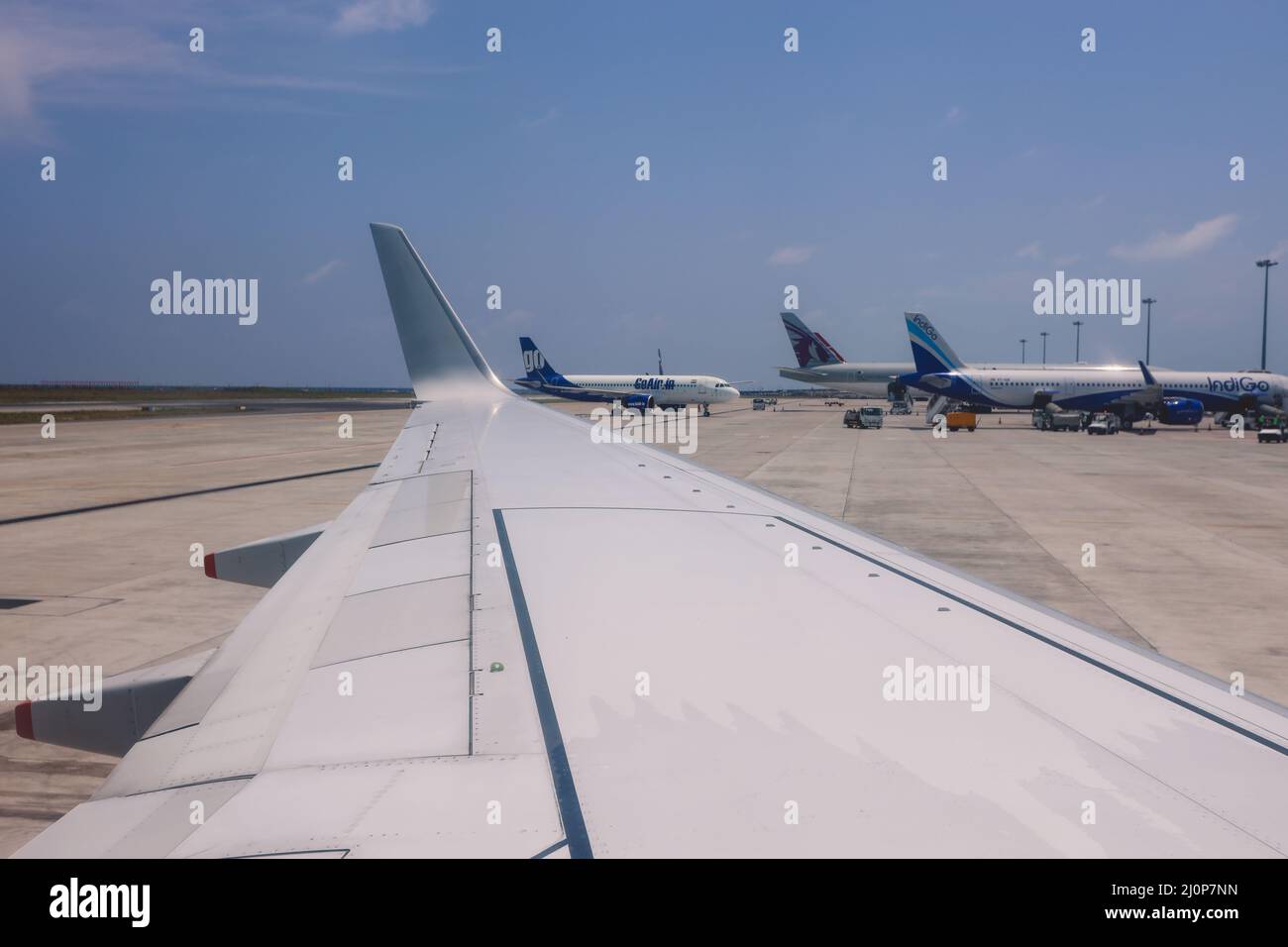 Aerial View to the White Aircraft Wing from the Window to Male Airport ...