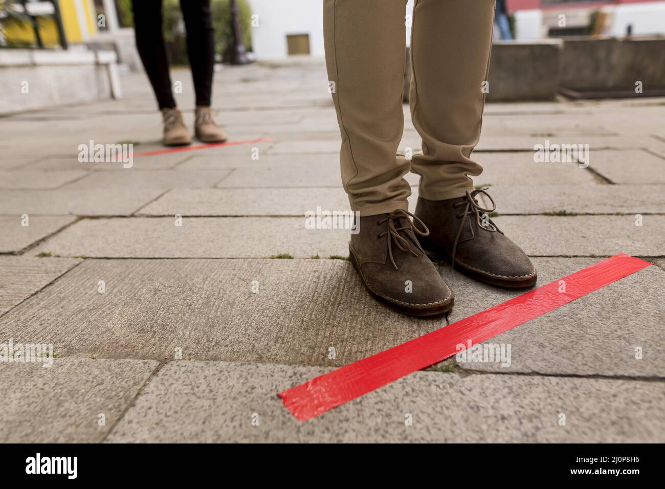 Woman queue outdoors with tape. High quality and resolution beautiful ...