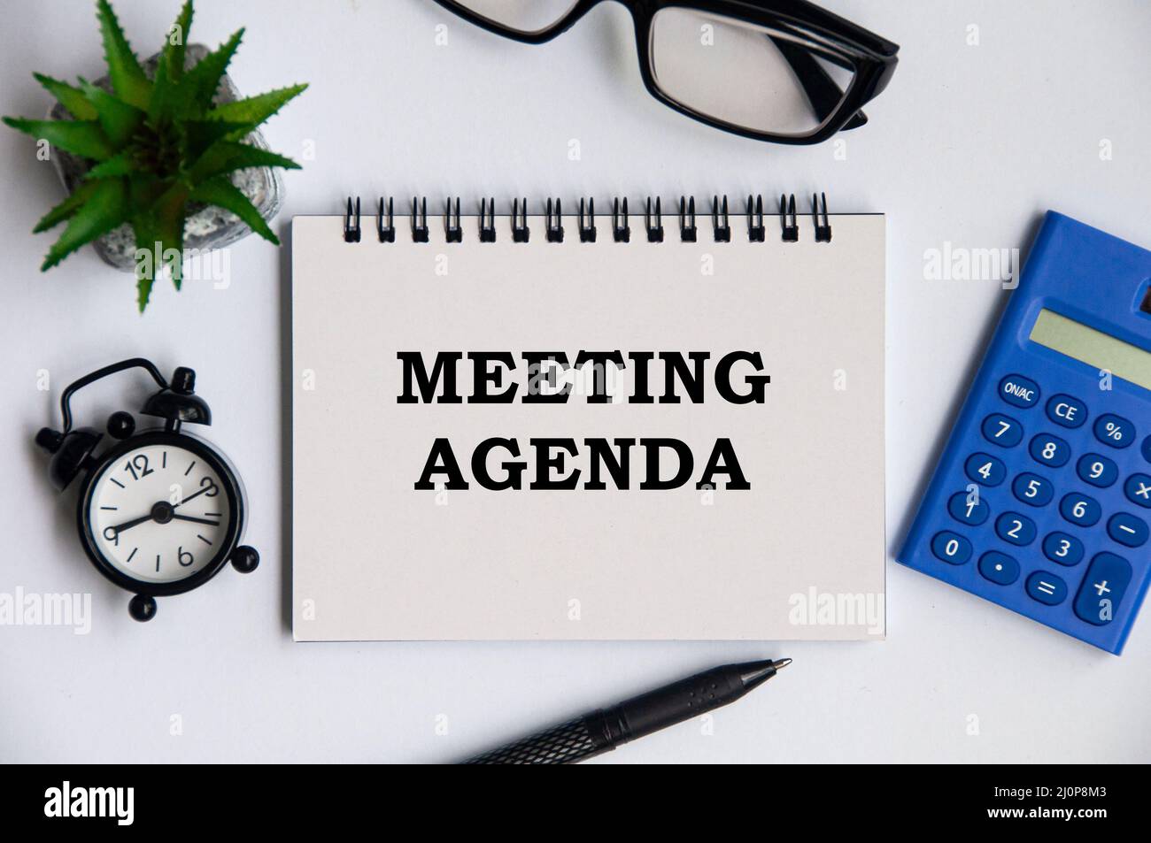 Meeting agenda text on notepad with office concept background Stock ...