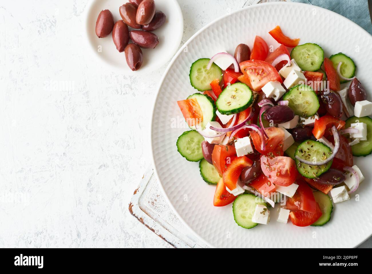Greek village salad horiatiki with feta cheese, olives, cherry tomato ...