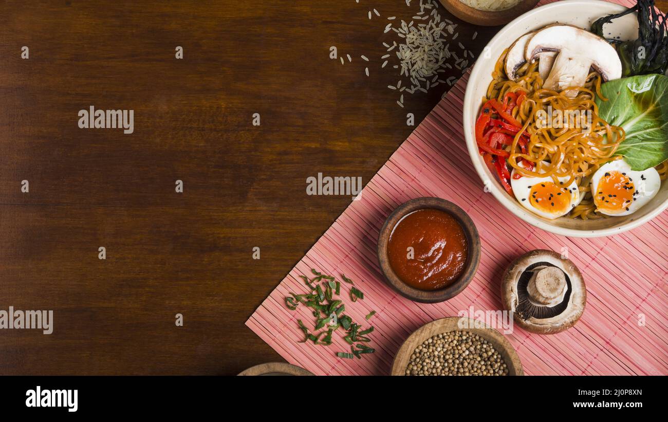 Ramen noodles asian style with sauces wooden table . High quality and ...