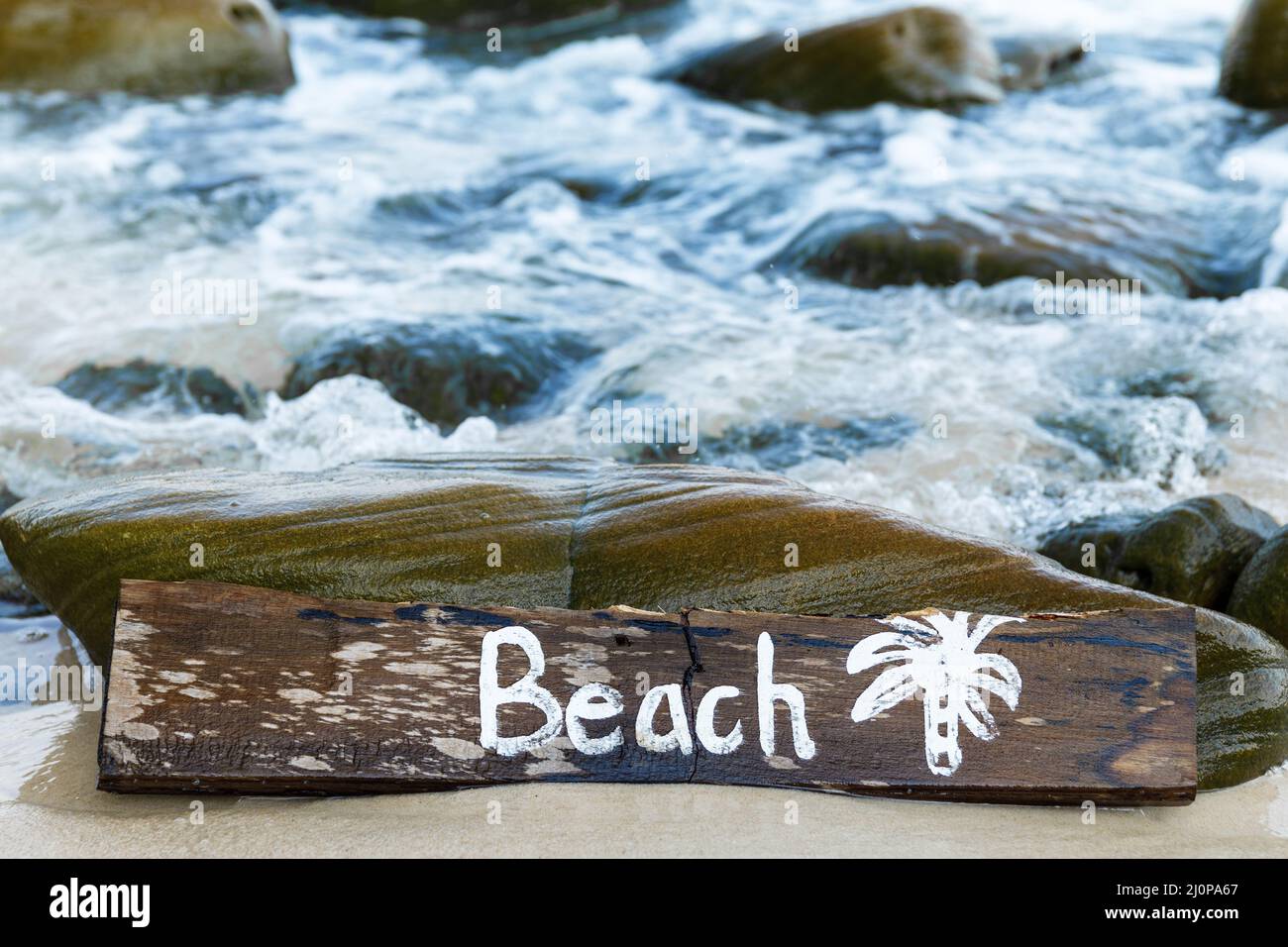 Wooden sign with lettering on the beach Stock Photo - Alamy
