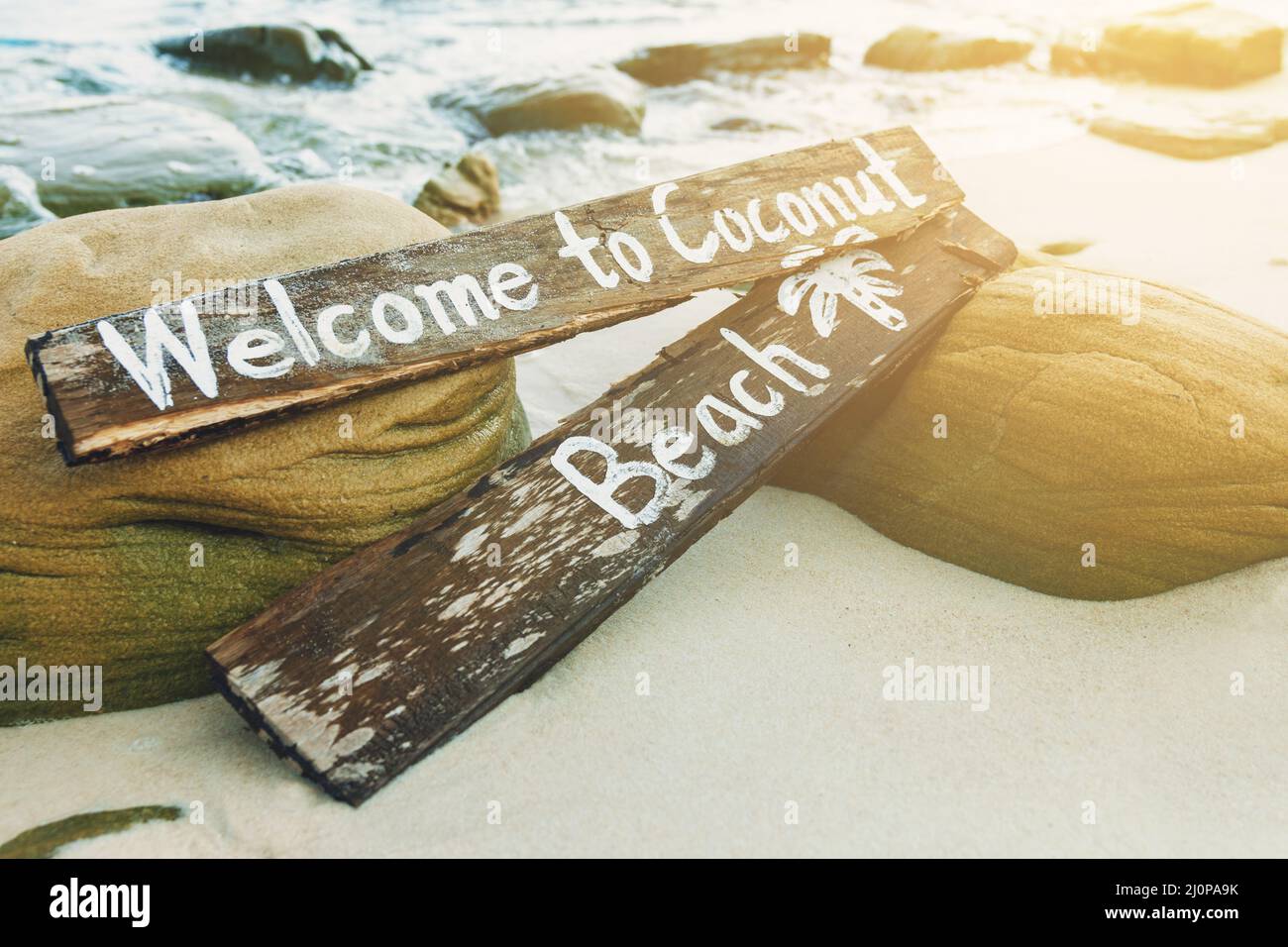 Wooden sign with lettering on the beach Stock Photo - Alamy