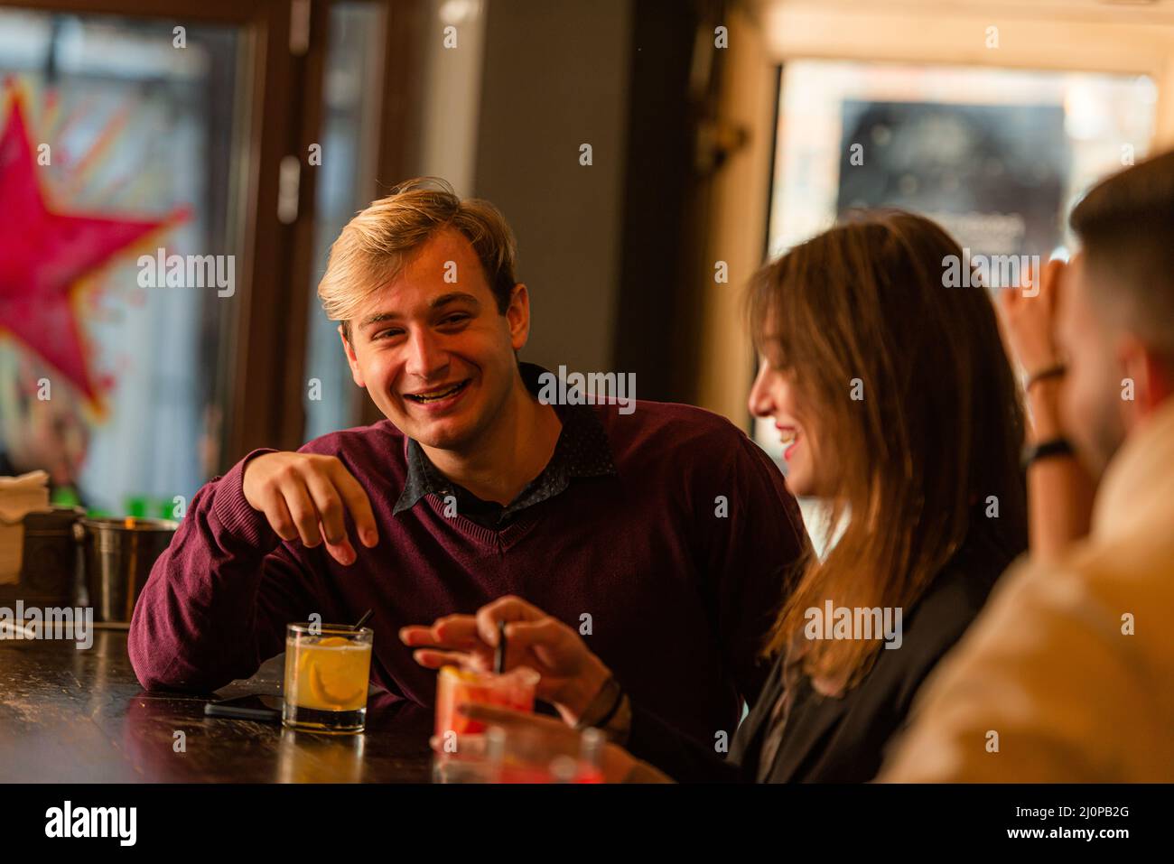 Two amazing and beautiful couples are laughing together Stock Photo - Alamy