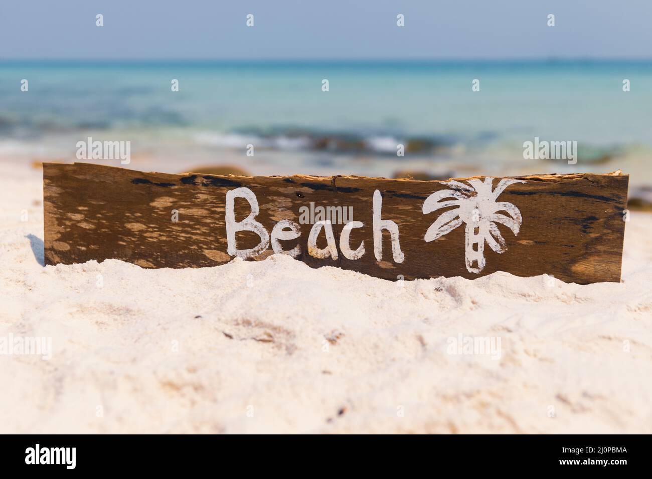 Wooden sign with lettering on the beach Stock Photo - Alamy