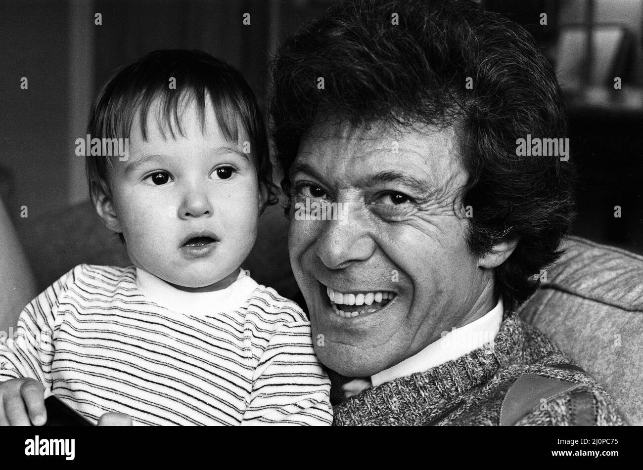 Lionel Blair pictured at home with his son. 19th October 1983 Stock ...