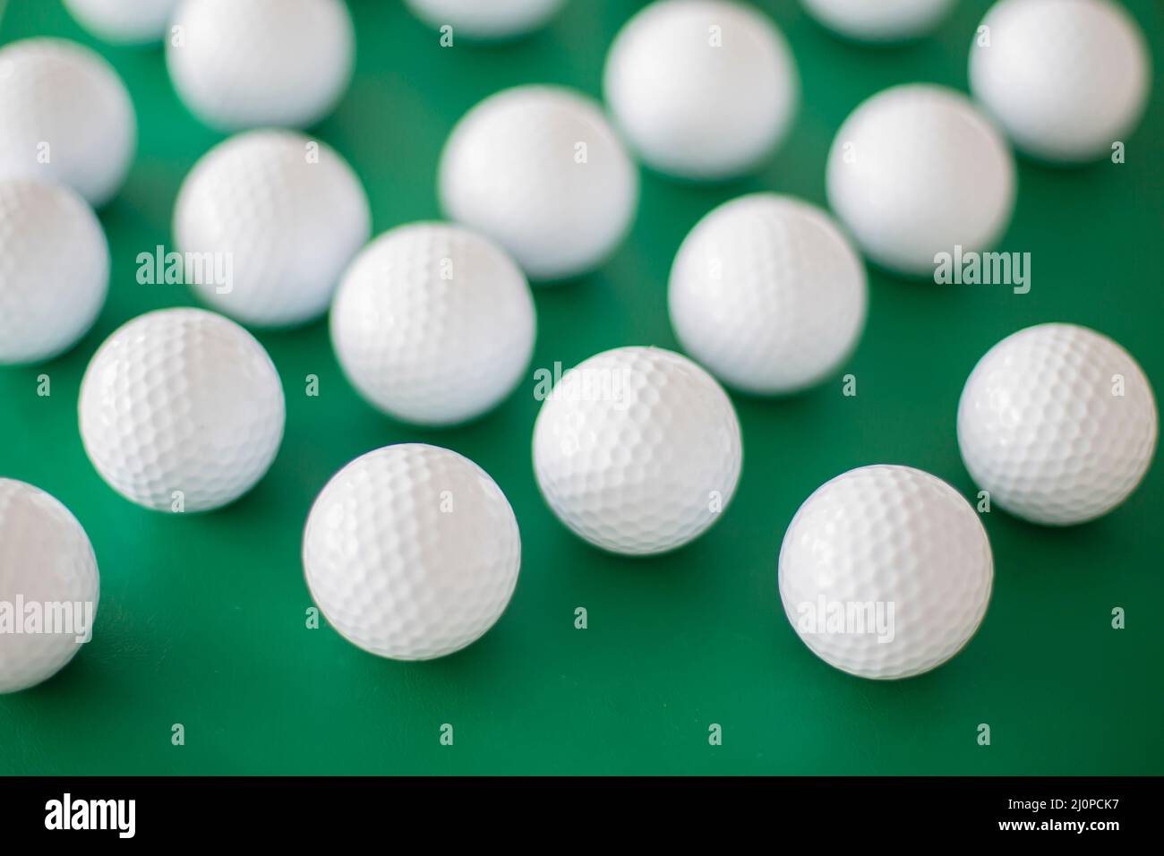 Group of golf balls on the green background Stock Photo - Alamy