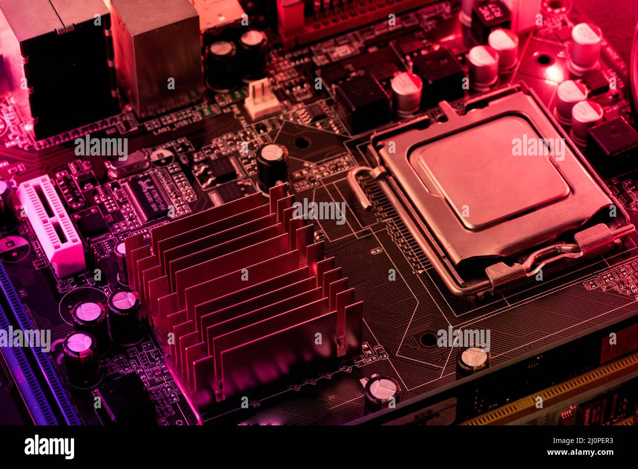 Computer motherboard background with blur neon multicolor glow, pc ...