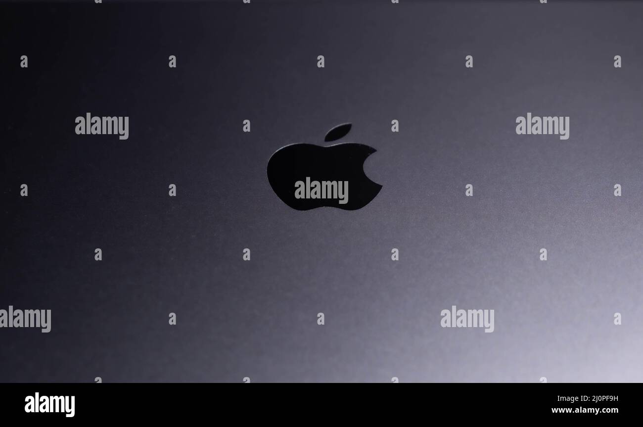 Spain, 03, 20, 2022. Macbook logo on gray metallic aluminium surface ...