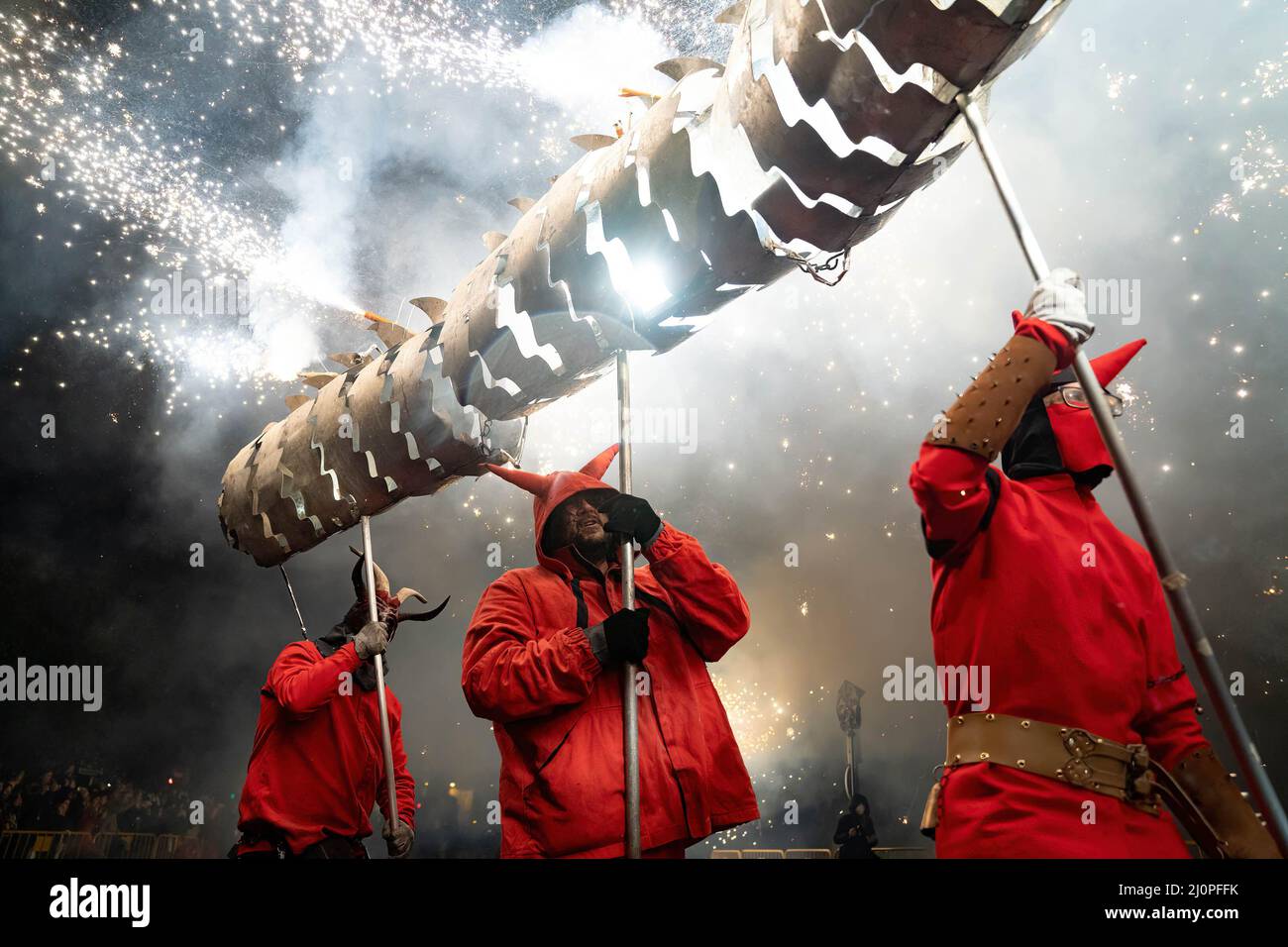 People hold fireworks during the Parade of Fire in Valencia. The Parade ...