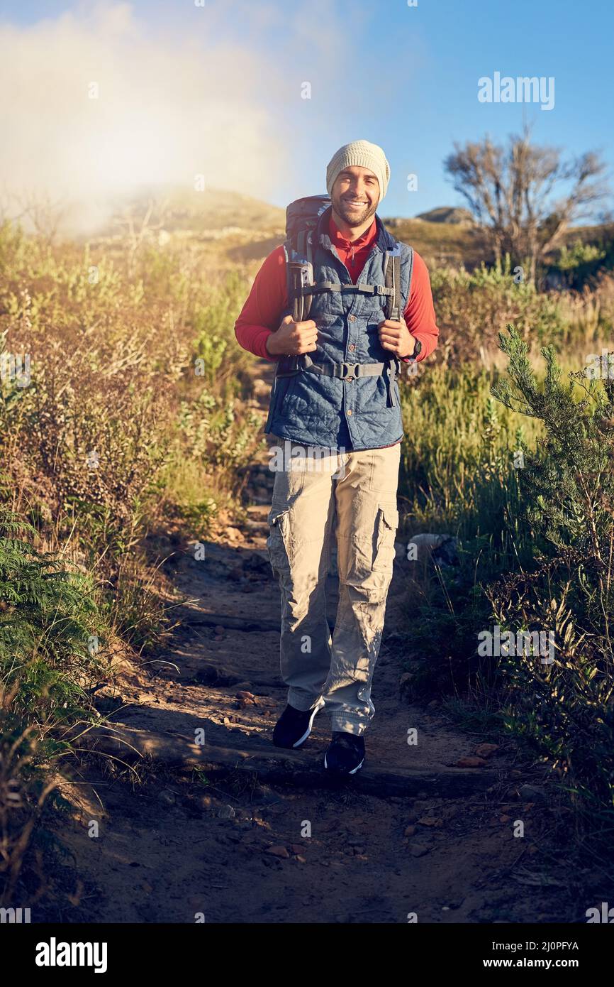 Go take a long walk in nature. Portrait of a happy hiker out on a ...