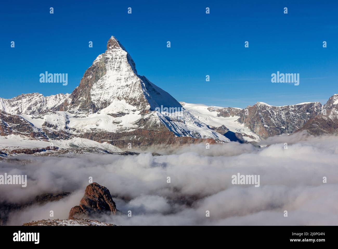 Panorama view of Alps above the clouds Stock Photo - Alamy