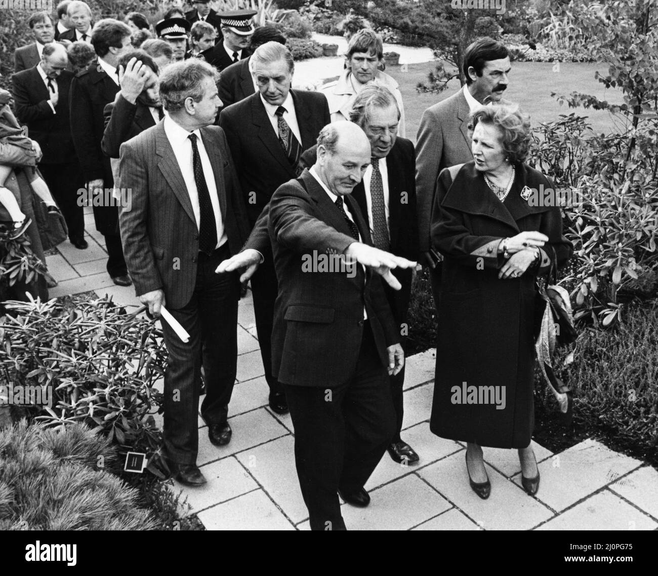 British Prime Minister Margaret Thatcher is led by Sir Leslie Young ...