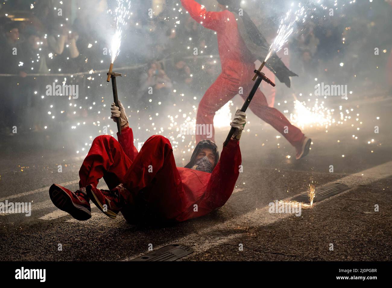 March 19, 2022, Valencia, Spain: A man with fireworks seen lying on the ...