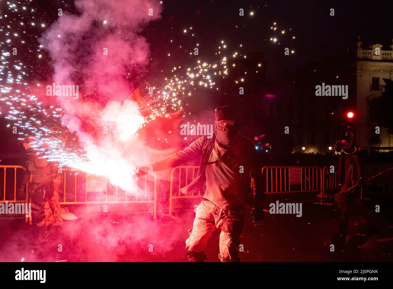 March 19, 2022, Valencia, Spain: A man holds fireworks during the ...