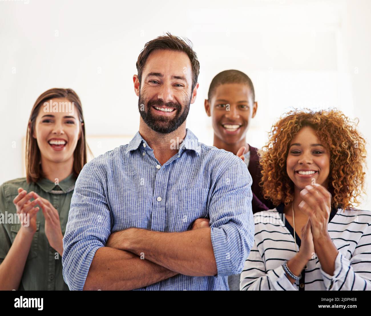 Their manager deserves a standing ovation. Portrait of a team of ...