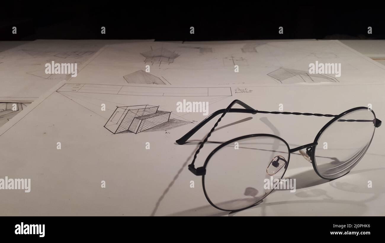 Close up shot of a optics on a architecture plan map on a table Stock ...