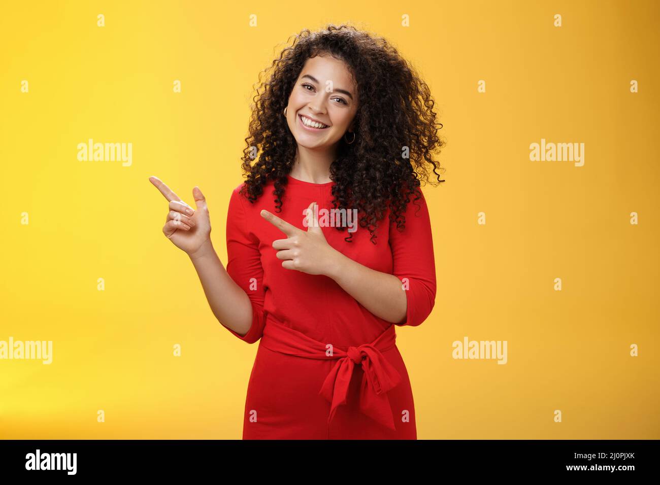 Friendly cute assertive female assistant in elegant red dress with ...