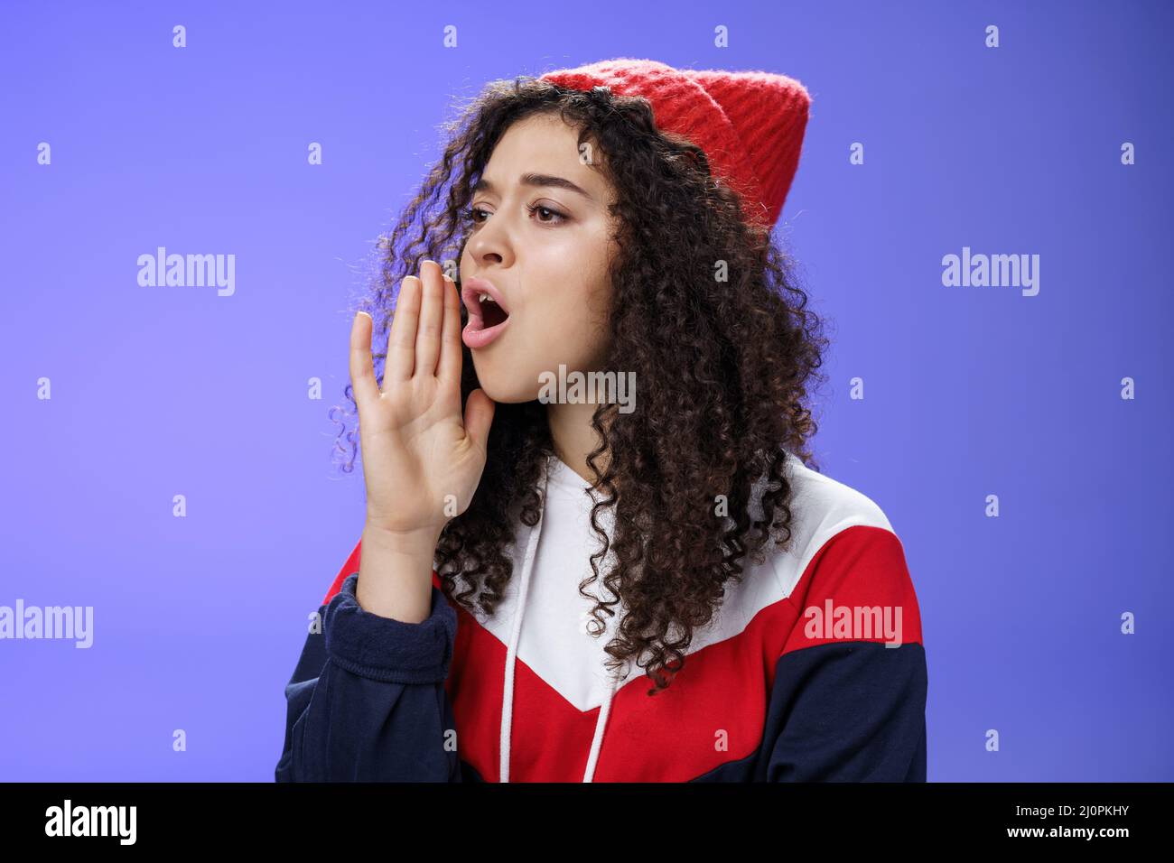 Portrait of worried sister calling sibling outdoors open mouth looking ...