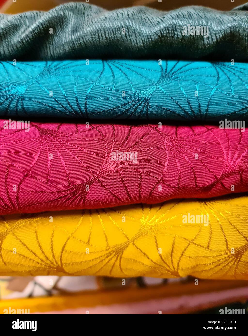 Detailed close up view on samples of cloth and fabrics in different ...