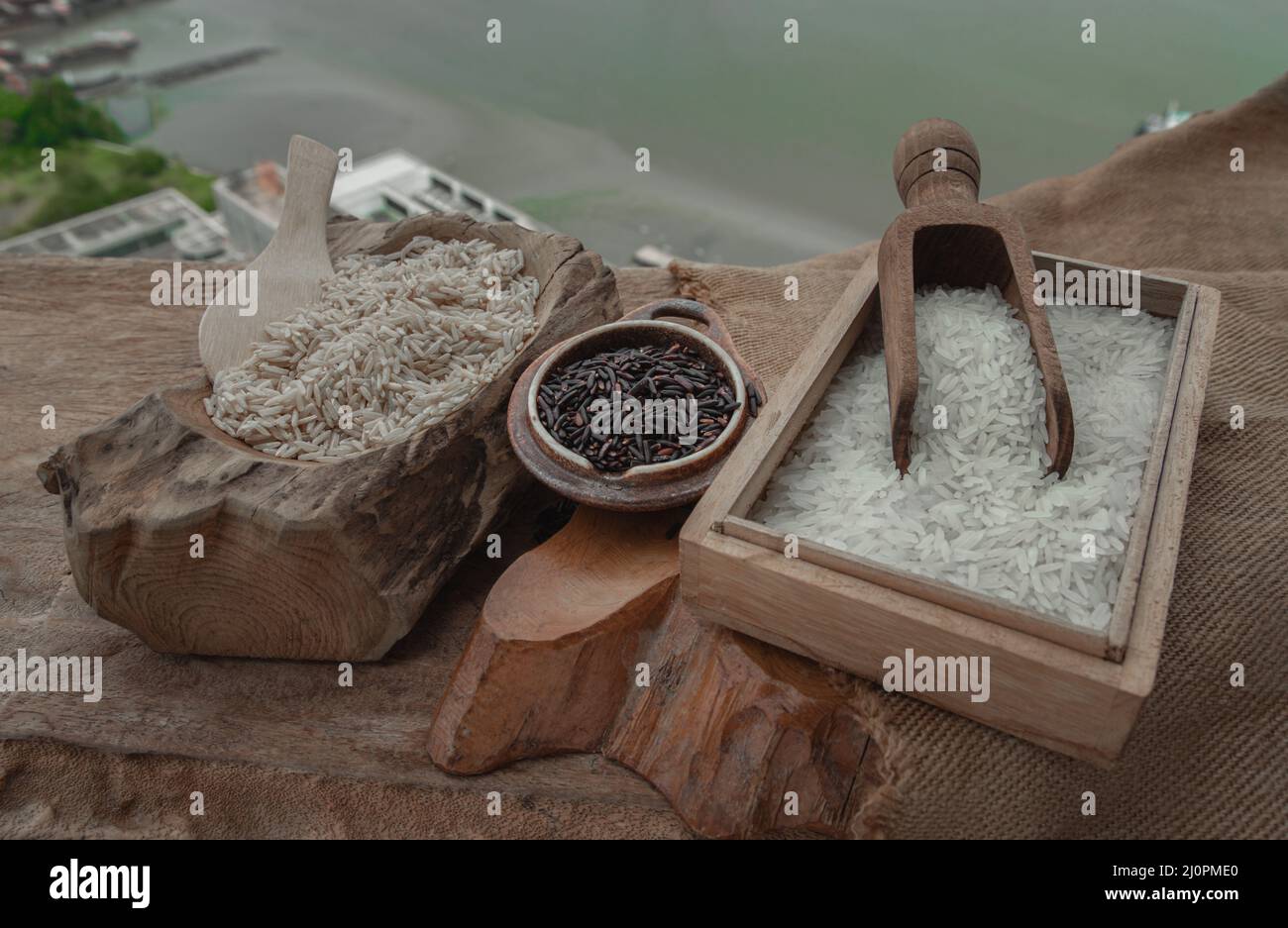 Various types of rice : Brown rice, Jasmine rice and Riceberry on old ...