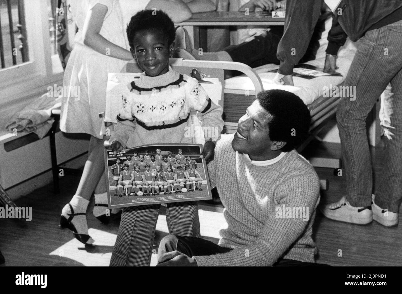 Andrew Hyman, aged 4, meets footballer Howard Gayle during a visit to ...