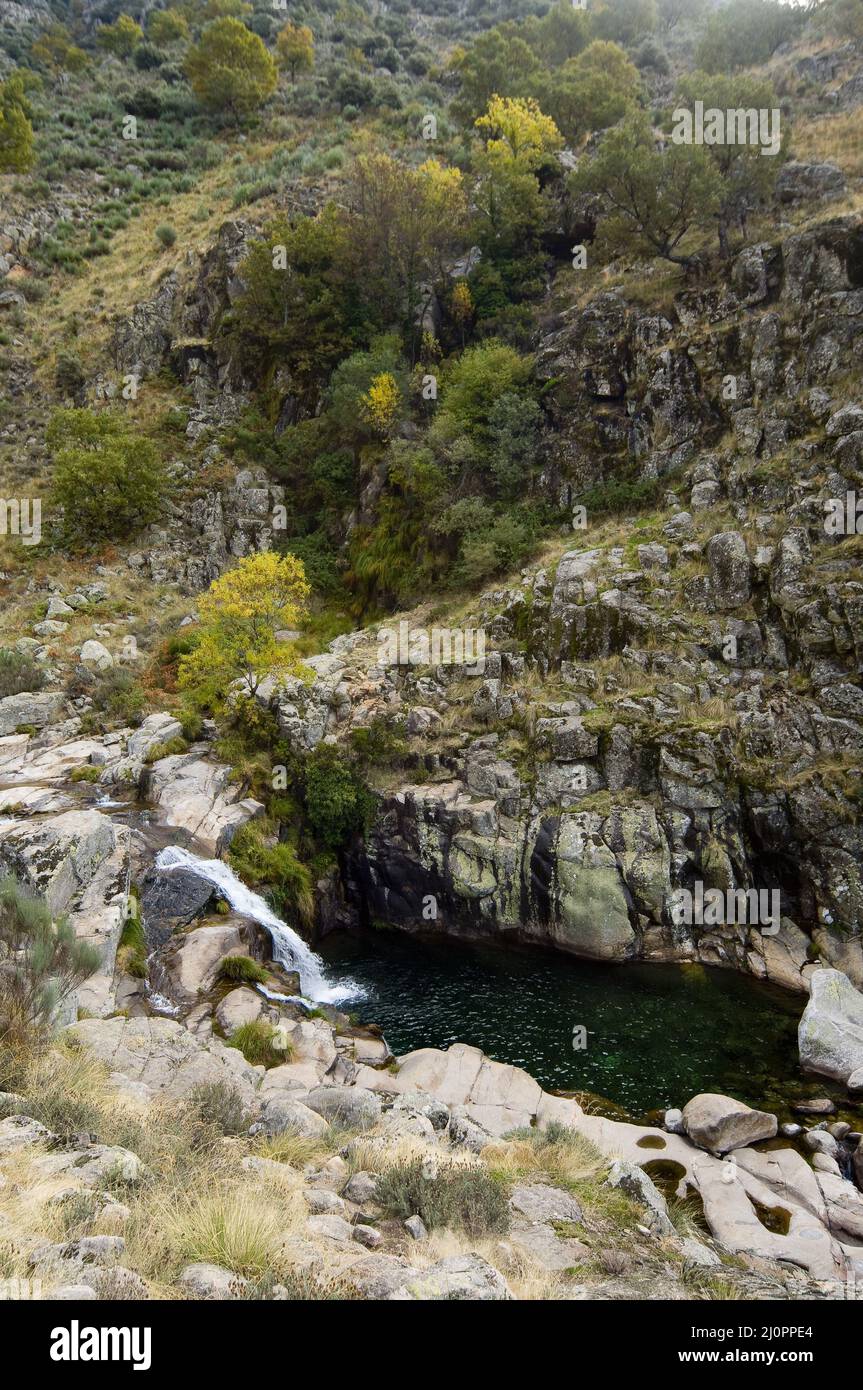 Vertical landscape of a river flowing through the mountains Stock Photo ...