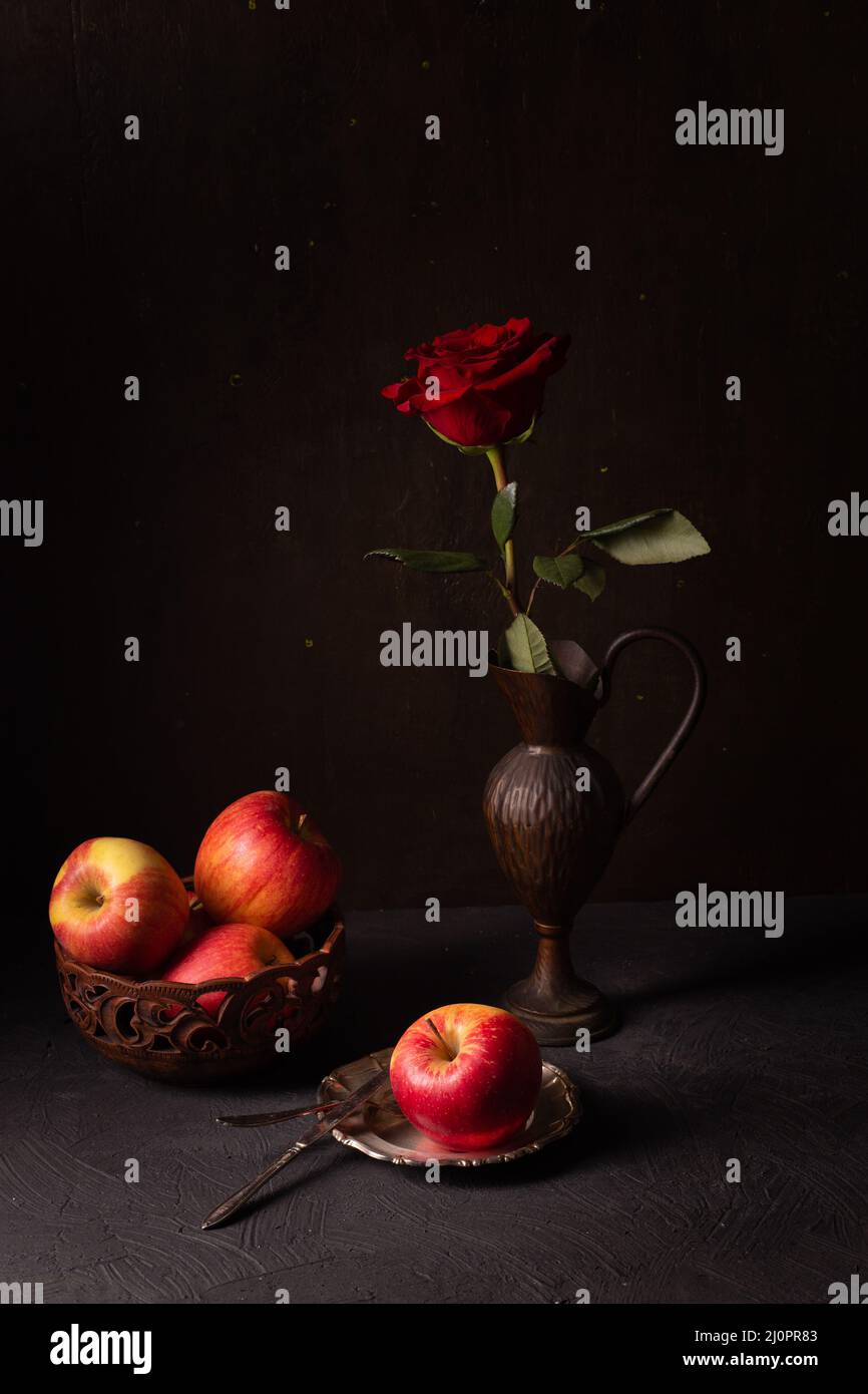 Rustic still life with apples and copper jug Stock Photo - Alamy