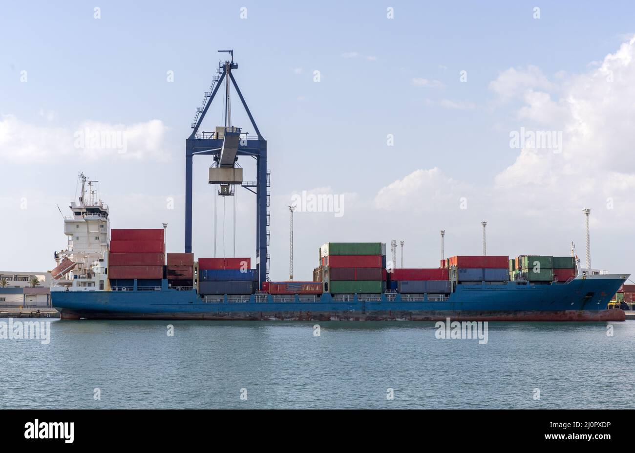 Photo of Container crane discharging container ship at container ...