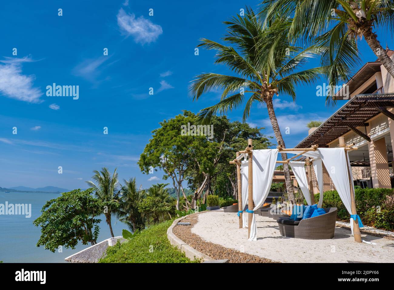 Luxury beach chairs on the beach of Phuket Thailand Stock Photo - Alamy