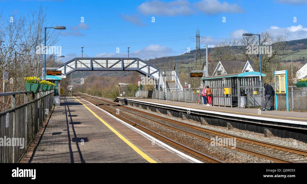 Pontyclun, Wales - March 2022: People waiting for a train at the ...