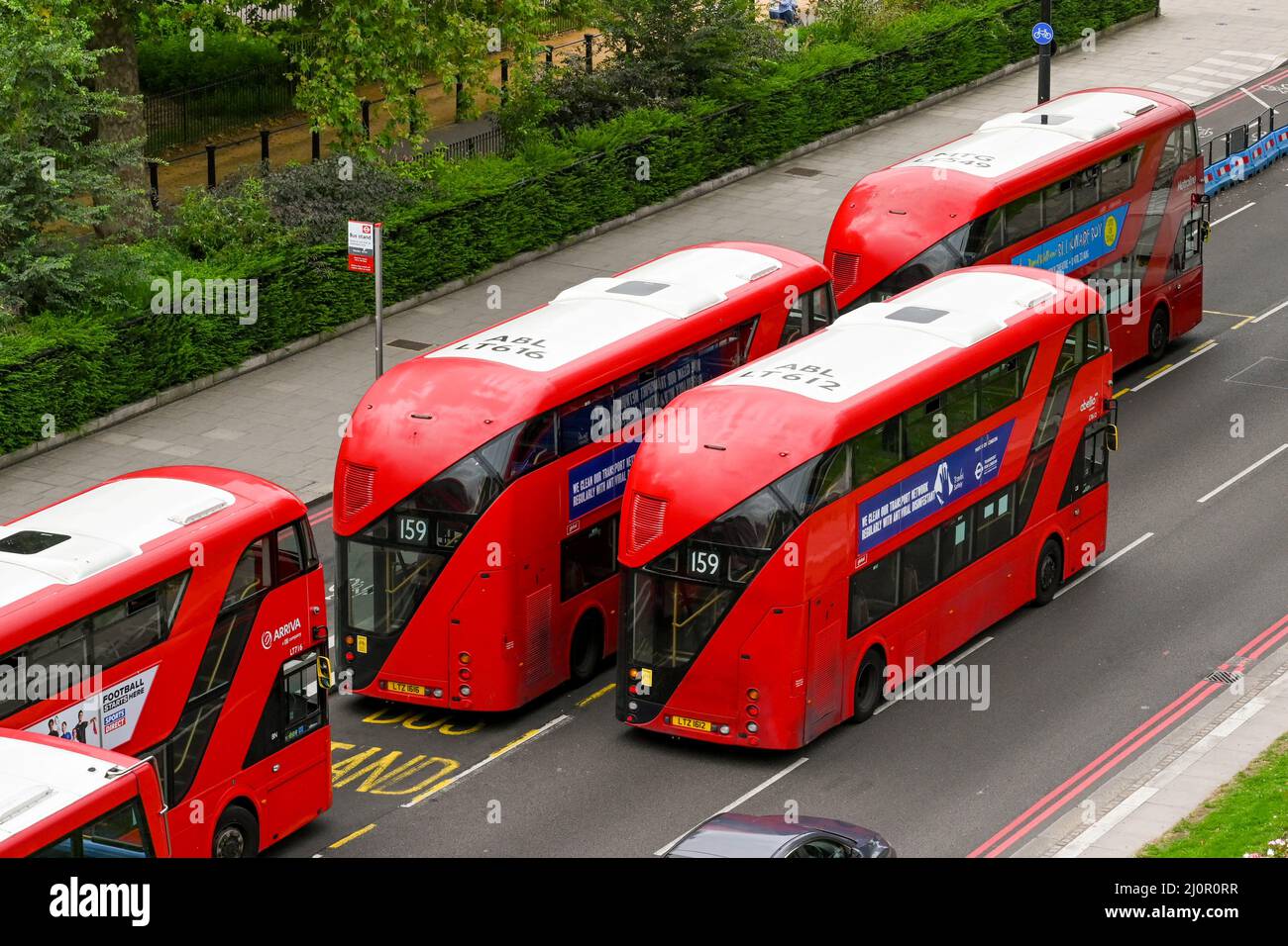 London, England - August 2021: Aerial view of London buses driving on a ...