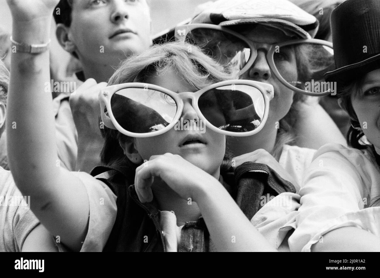 Fans at the "Summer of 84" concert at Wembley Stadium, which featured ...