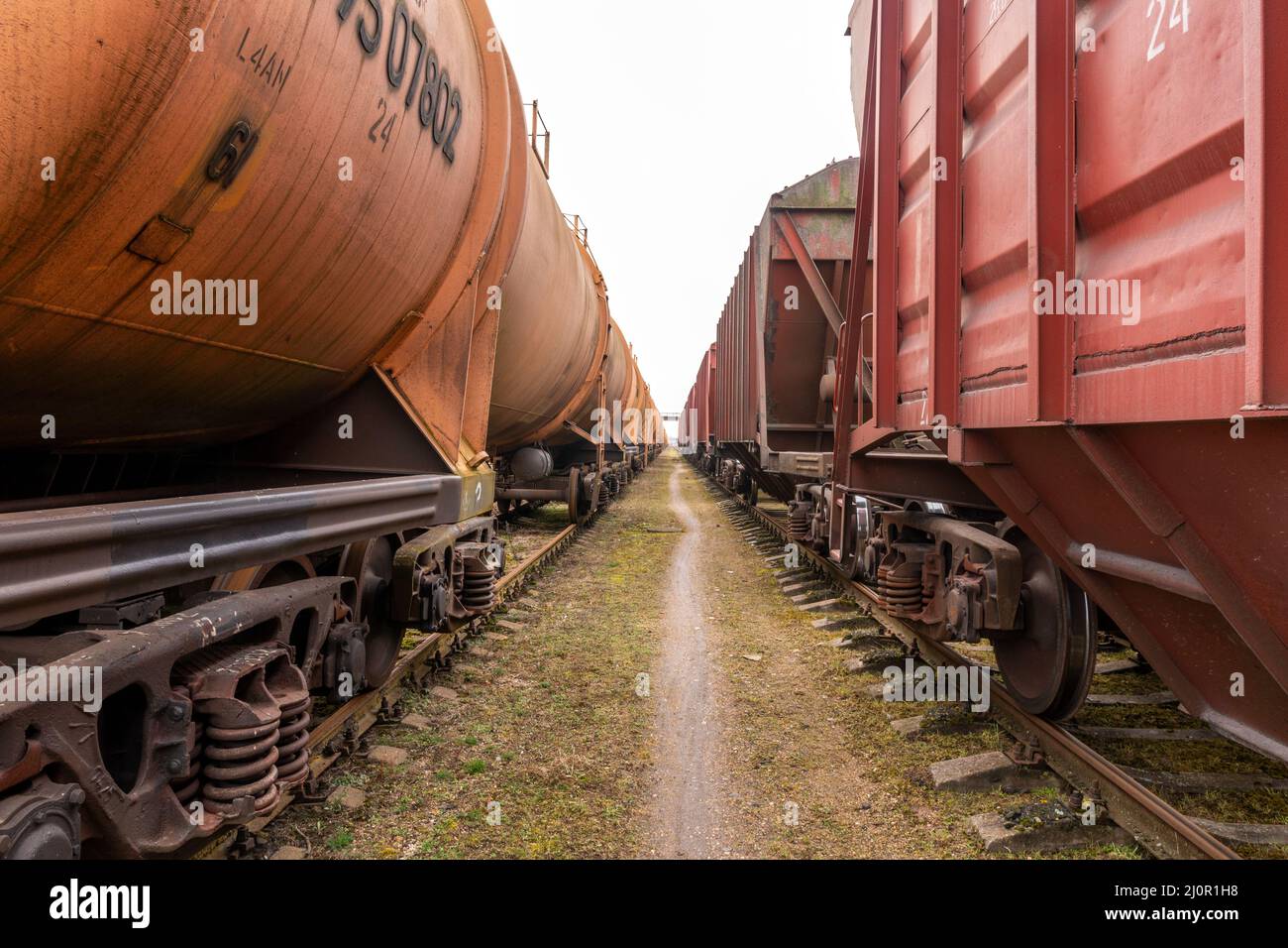 Walking between two cargo trains Stock Photo - Alamy
