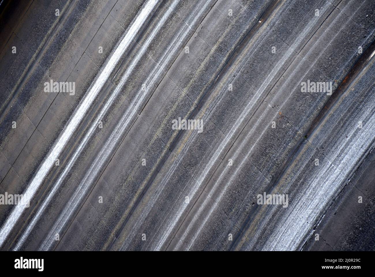 Background image shows concrete covered in weathered streaks. White and ...