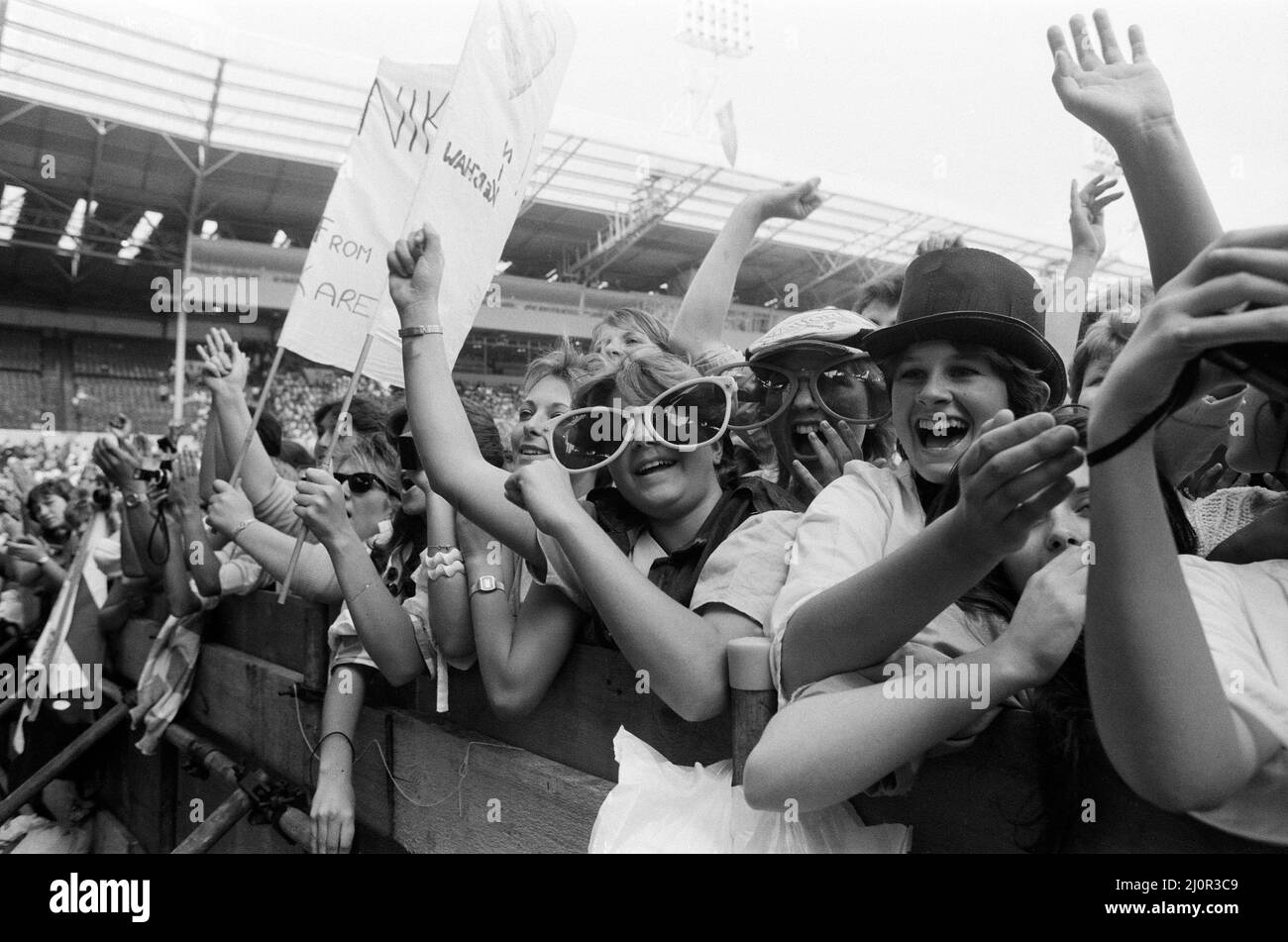 Fans at the "Summer of 84" concert at Wembley Stadium, which featured ...