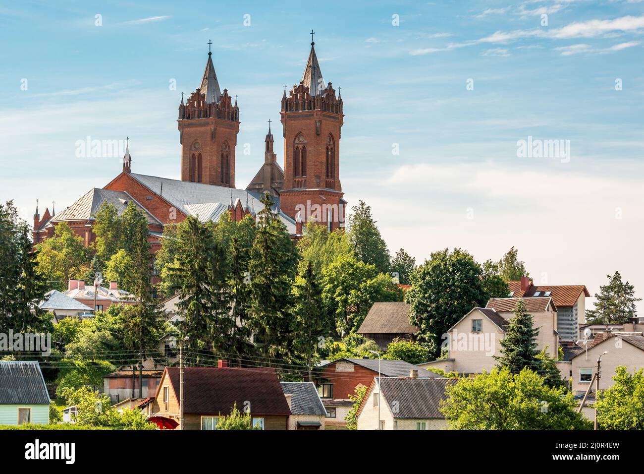 Tall building small houses hi-res stock photography and images - Alamy