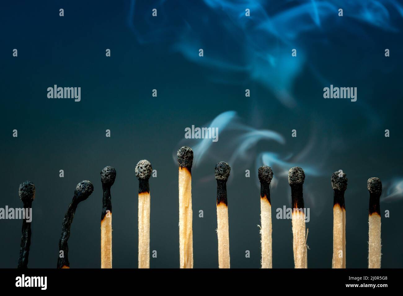 Safety matches burned with white and blue smoke Stock Photo - Alamy
