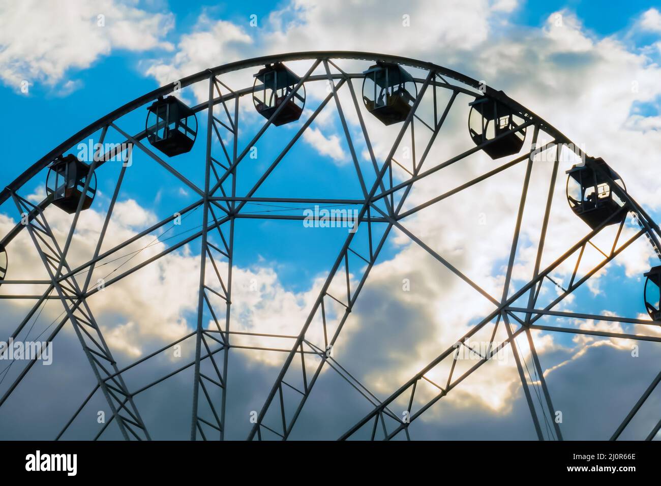 Ferris wheel rotating against cloudy hi-res stock photography and ...