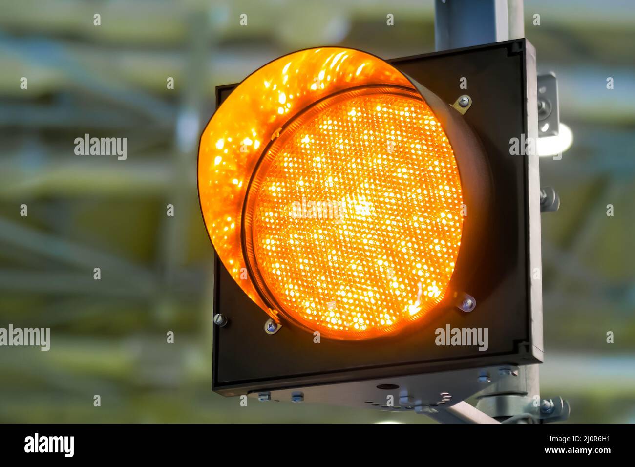 Close up view: signal LED orange traffic light blinking at transport ...